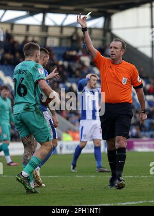 Match referee Carl Boyeson shows Swindon Town's Blair Sturrock (l) a ...