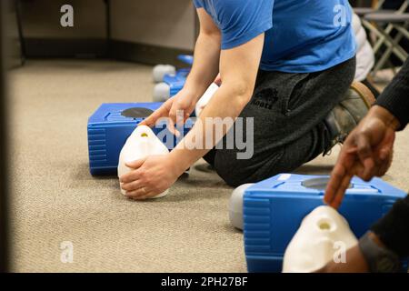 CPR training class by security guard in office Stock Photo - Alamy