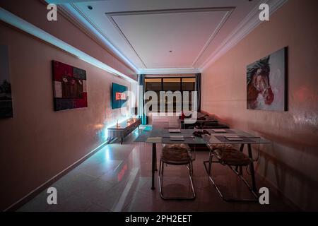 Cozy living room with the Netflix logo on a large smart TV Stock Photo ...