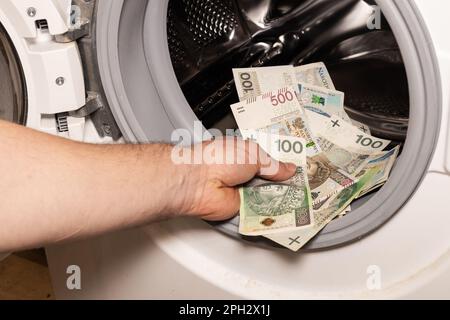 Polish money thrown into the washing machine, Concept, Money laundering ...