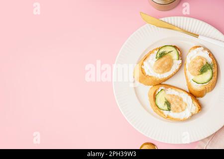 Delicious canapes with caviar of capelin on white background Stock ...