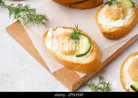 Delicious canapes with caviar of capelin on white background Stock ...