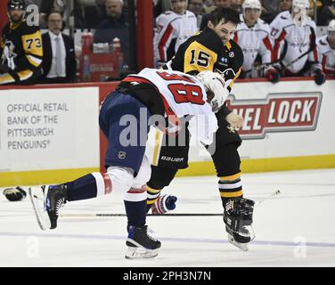 Washington Capitals defenseman Rasmus Sandin (38) fights with Columbus ...