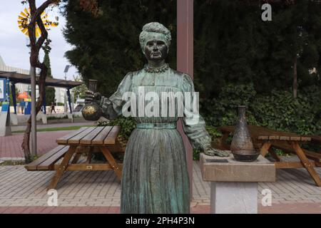 The Statue of Marie Curie Holding Her Science Experiment Equipment ...