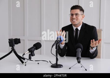 Business man giving interview at official event Stock Photo - Alamy