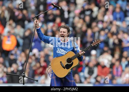 Callum Beattie performs on the pitch at half time during the Legends ...