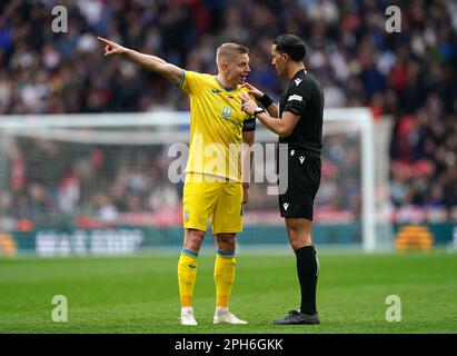 Ukraine's Oleksandr Zinchenko appeals to referee Serdar Gozubuyuk ...