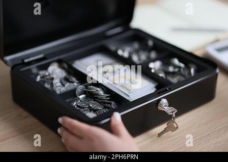 Big cash register of accountant with safety lock and key Stock Photo ...