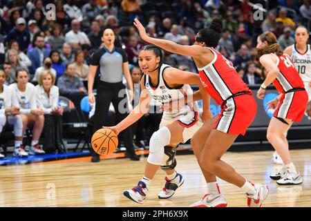 UConn guard Azzi Fudd (35) dribbles around Dayton guard Ivy Wolf (10 ...