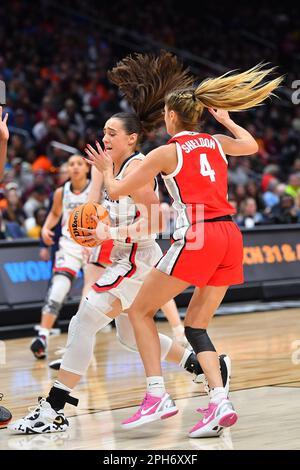 UConn guard Nika Muhl (10) launches a three point shot over Seton Hall ...