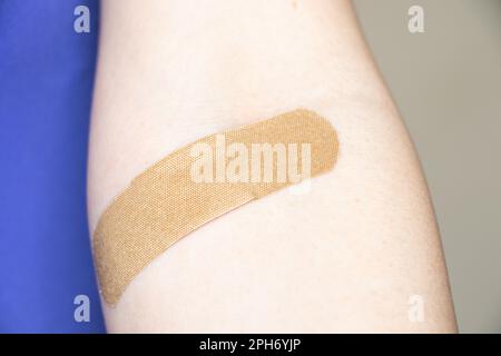 a plaster on the arm after taking blood from a vein, taking tests Stock ...