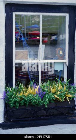 Polperro village, with its narrow, winding streets and traditional ...