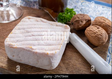 Cheese collection, Belgian soft yellow cow milk cheese with white mold ...