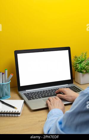 Laptop screen. Woman uses her notebook computer while sitting at desk ...