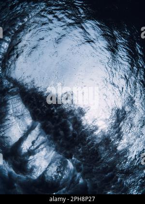 Wave textures with vortex underwater in transparent sea water. Swell in ...