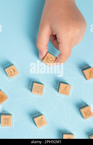 Hand holding a wooden cube with symbol of crisis management concept ...