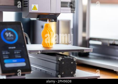 Application for control 3D printer displayed on smartphone. Against the ...