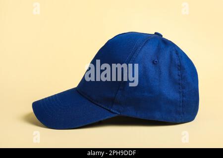 Stylish blue baseball cap on yellow background. Space for text Stock ...
