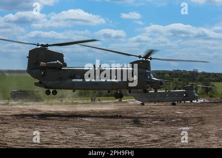 Two CH47 Chinook helicopters operated by the RAF preparing to take off ...