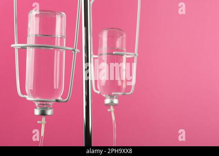 IV infusion set on pink background. Space for text Stock Photo - Alamy