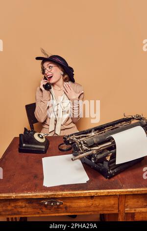 Pleasantly surprised young woman over isolated yellow background Stock ...