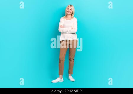 Full length photo of sweet thoughtful schoolgirl wear yellow crop top ...
