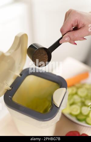 Person making a compost at home with bokashi bran. Female composting ...