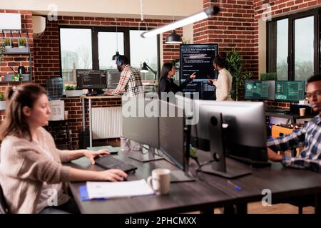 Software programmers analyzing html code and database, brainstorming ...