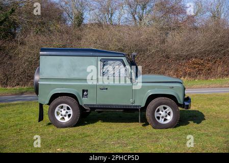 Green Land Rover Defender equipped with five-spoke alloy wheels and ...