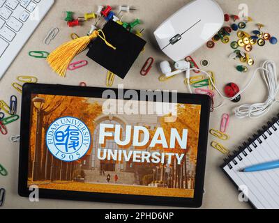 In this photo illustration, Fudan University logo seen displayed on a ...