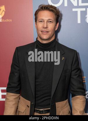 Luke Bracey wearing suit by Alexander McQueen attends premiere of One ...