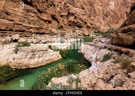 Turquoise water flowing through the Wadi Shab canyon, Wadi Ash Shab ...