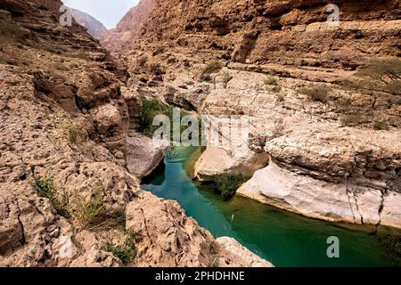 Turquoise water flowing through the Wadi Shab canyon, Wadi Ash Shab ...