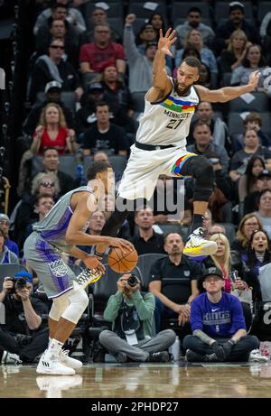 Minnesota Timberwolves center Rudy Gobert, top right, goes up to shoot over Cleveland Cavaliers ...