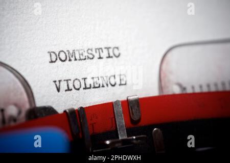Domestic violence text written with a typewriter Stock Photo - Alamy