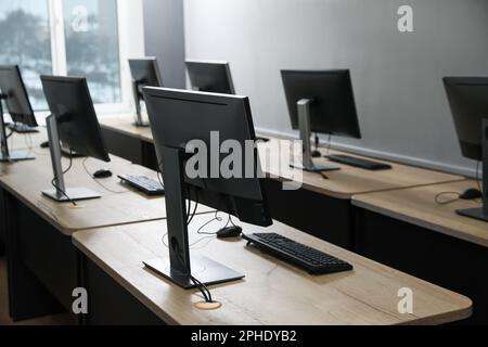 Many modern computers in open space office Stock Photo - Alamy