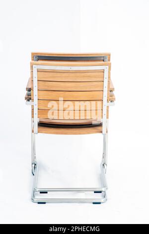 Brown chairs on wooden frame in a casual space Stock Photo - Alamy