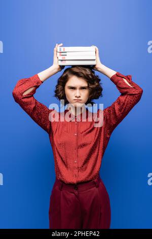 Image of attractive displeased woman with curly red hair showing finger ...