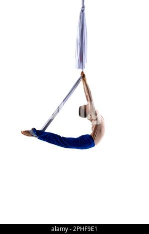 Levitation. Young man, professional aerial acrobat, gymnast training ...