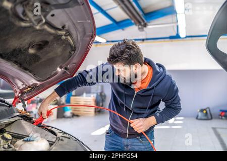 starting the car engine using the starter cable Stock Photo - Alamy