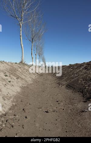 Dry irrigation ditches in the fields Stock Photo - Alamy
