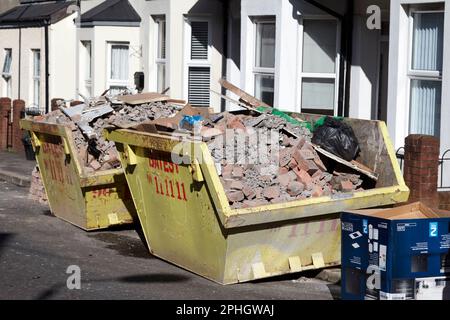 Builder's skip full of bricks Stock Photo - Alamy