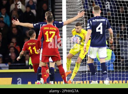 Scotland goalkeeper Angus Gunn saves from Japan's Junya Ito during the ...