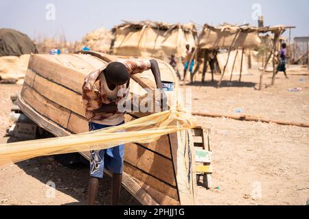 Kalokol, Kenya. 14th Feb, 2023. Submerged trees emerge from the surface ...
