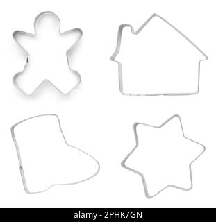Set with cookie cutters of different shapes on white background, top ...