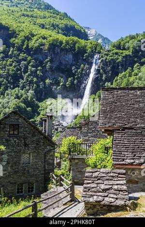The tradtional stone houses with church tower in the beautiful village ...