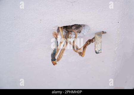 Open bad dangerous electrical wiring Stock Photo - Alamy