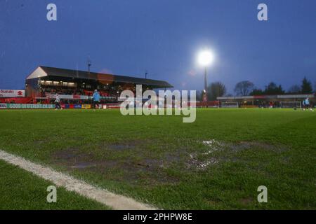 Heavy rain fall causes puddles on the pitch ahead of the Sky Bet League ...