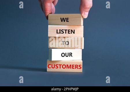 We listen to our customers symbol. Concept words We listen to our ...