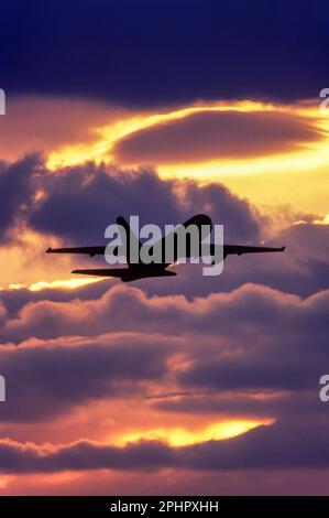 SILHOUETTE OF AIRBORNE BOEING 767 COMMERCIAL PASSENGER AIRCRAFT IN ...